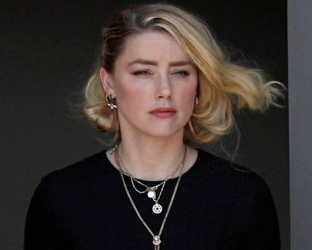 Amber Heard flees after being caught buying low-cost clothes