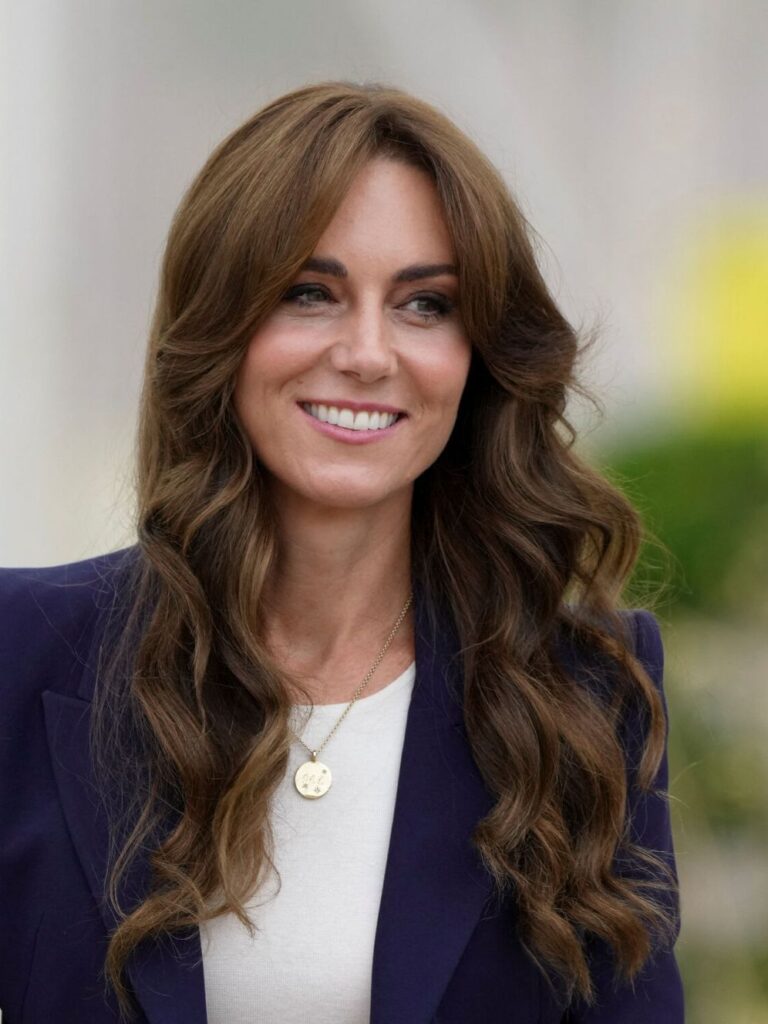 Kate Middleton appears with "bandaged" hand and in wheelchair