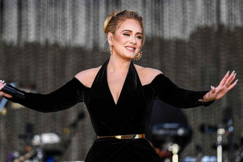 Adele surprises fans by announcing her engagement in concert