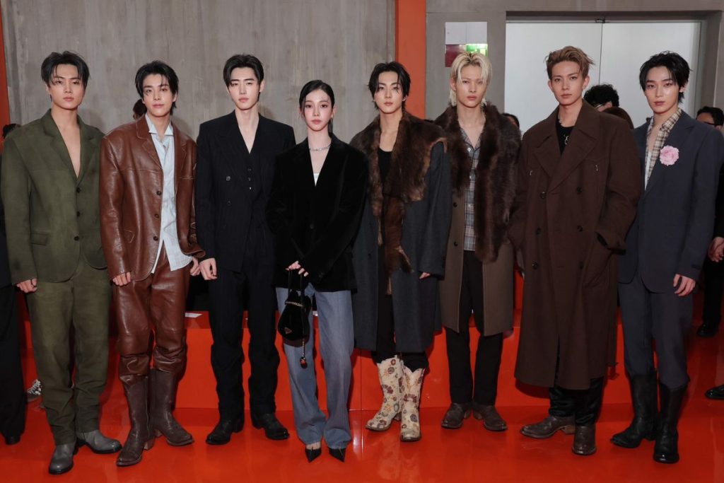 ENHYPEN poses alongside aespa’s Karina at Prada’s fashion show